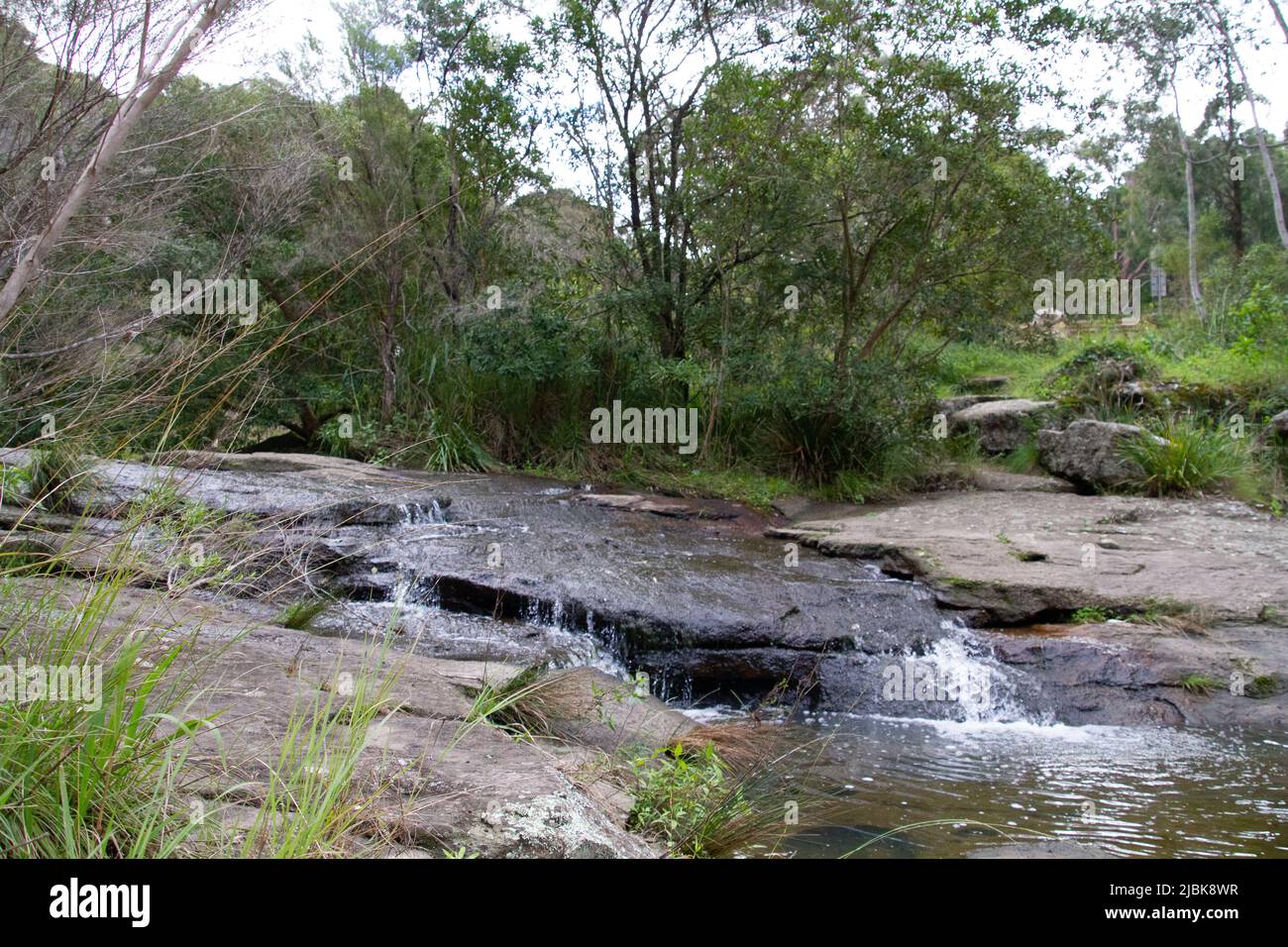 Waterfall among the rocks Stock Photo - Alamy