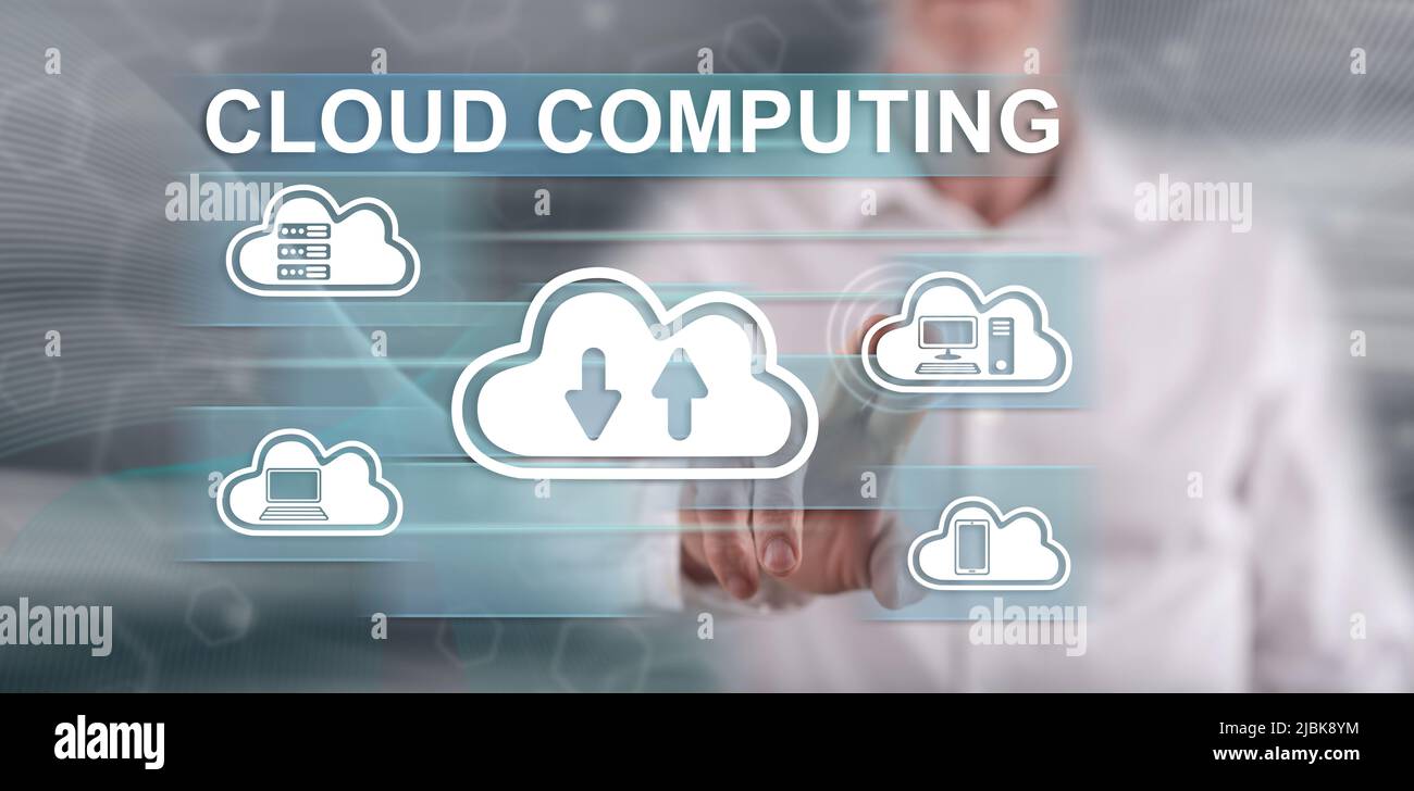 Man touching a cloud computing concept on a touch screen with his ...