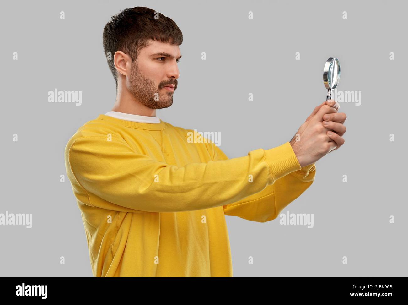 Man magnifier hi-res stock photography and images - Alamy