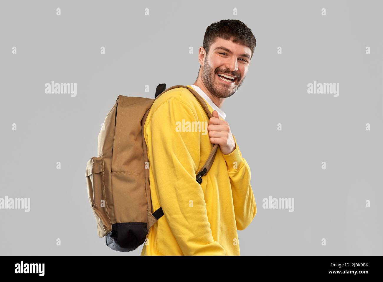 Portrait laughing man backpack hi-res stock photography and images - Alamy