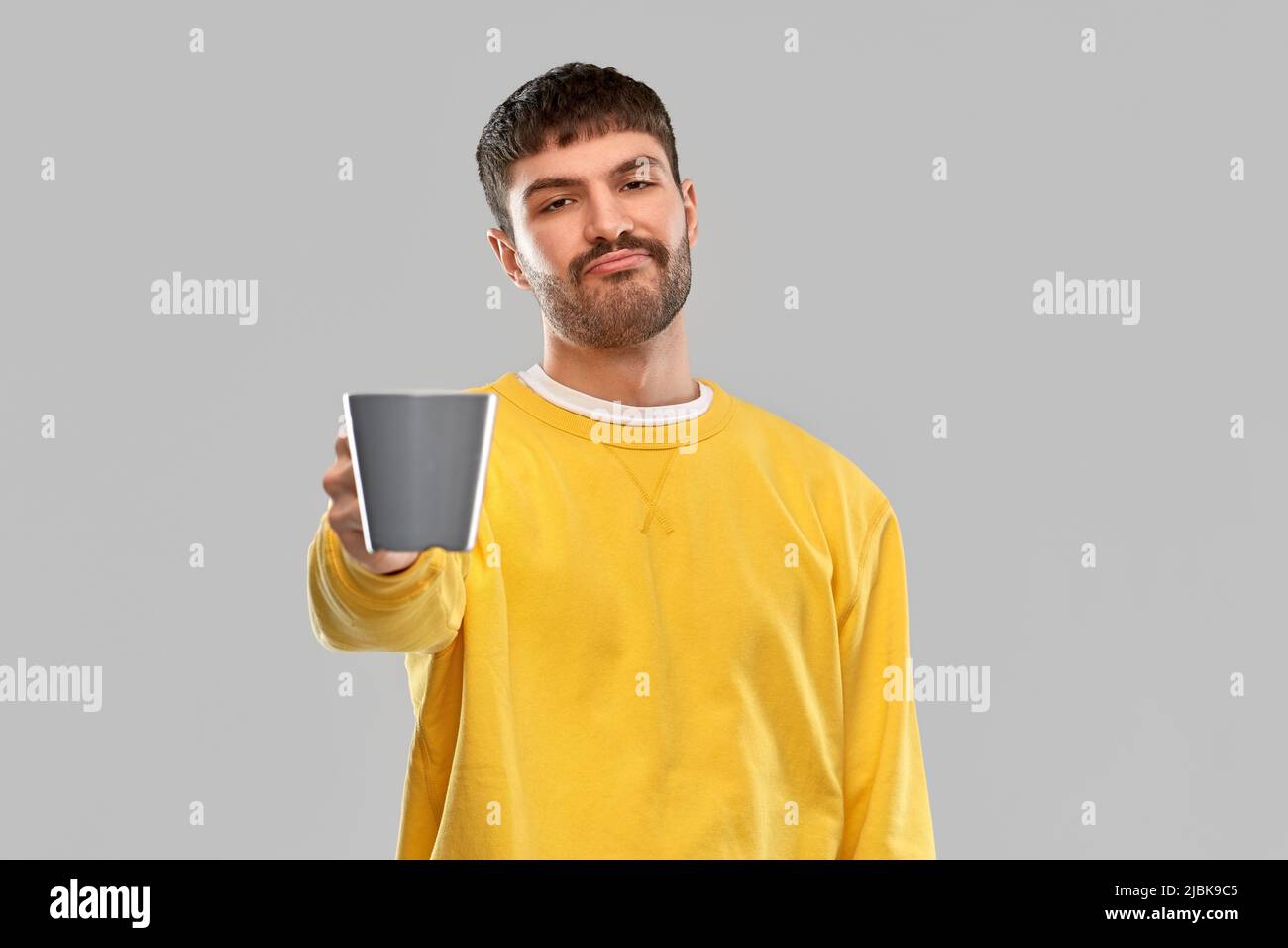 Unhappy young man cup hi-res stock photography and images - Alamy