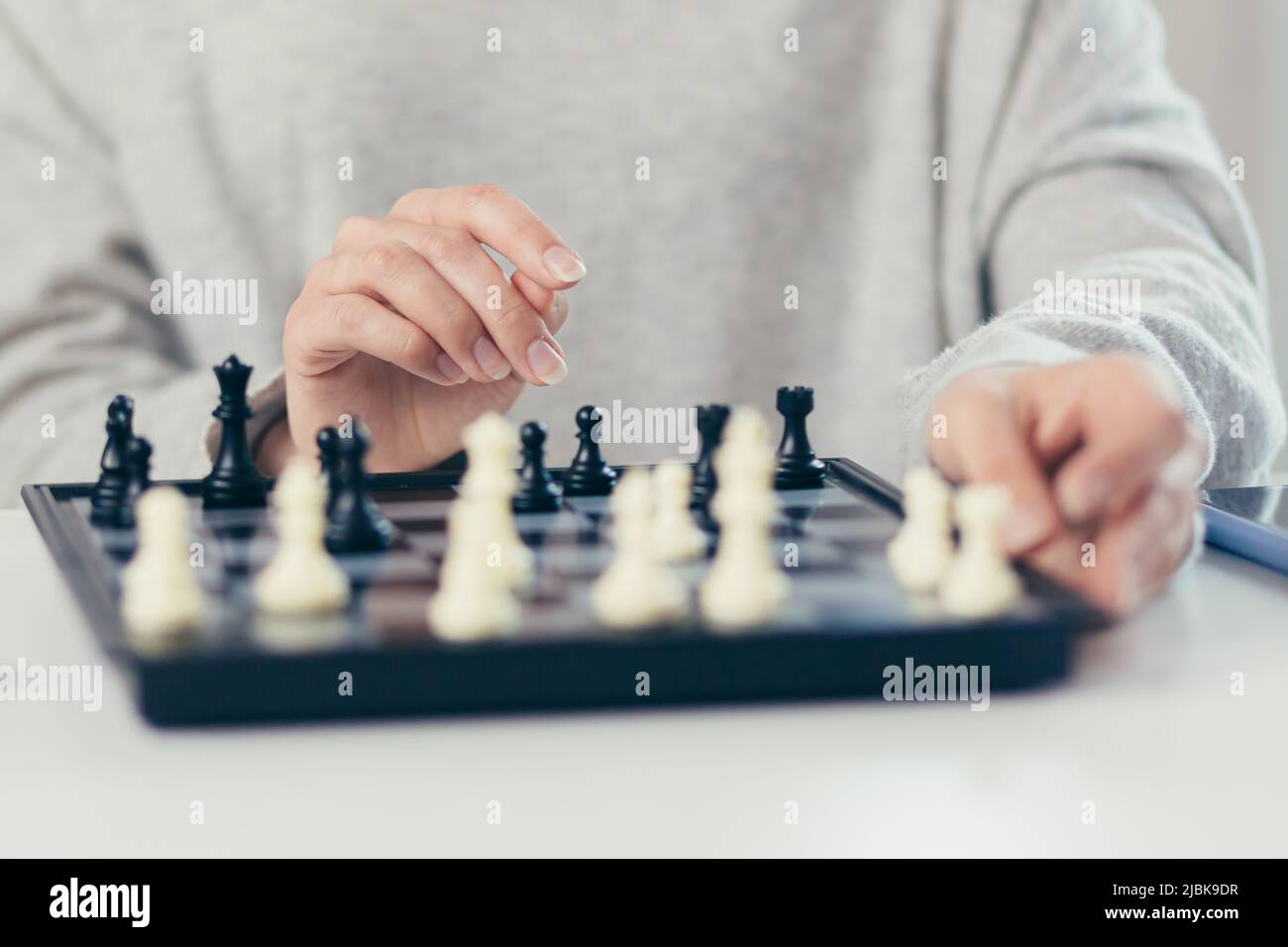 Woman hands playing chess close hi-res stock photography and images - Alamy