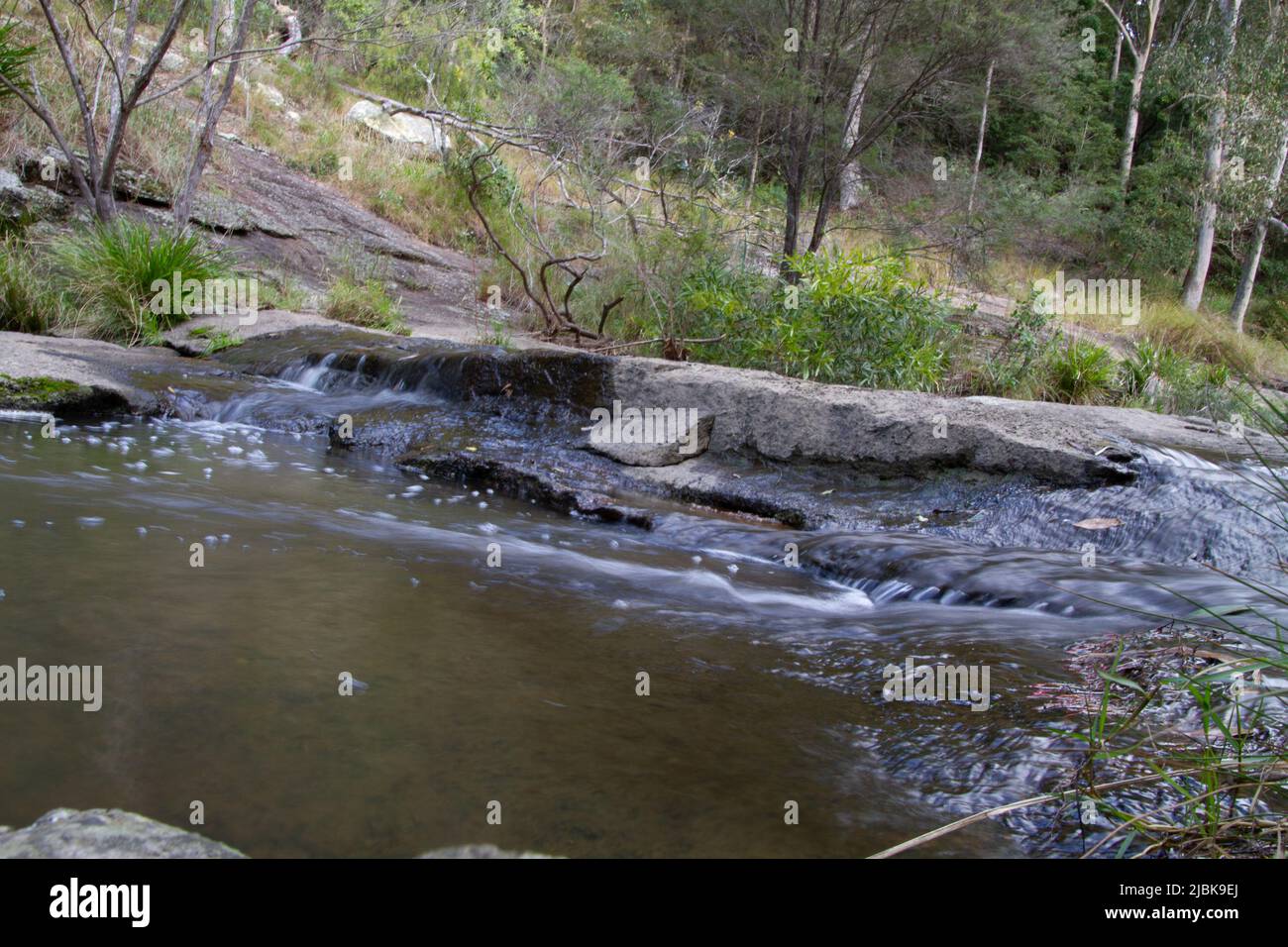 Waterfall among the rocks Stock Photo - Alamy