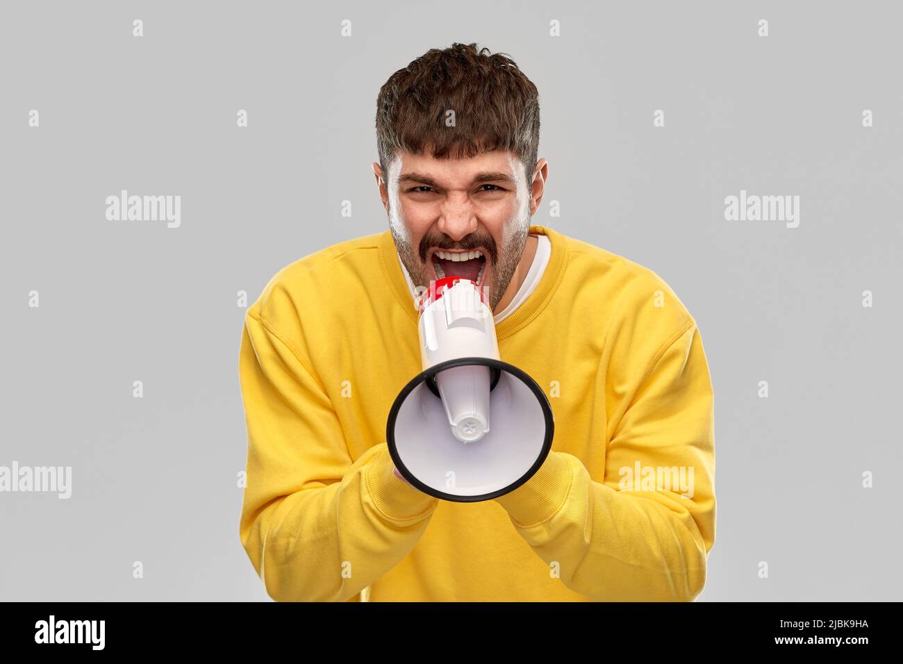 angry man shouting to megaphone Stock Photo - Alamy