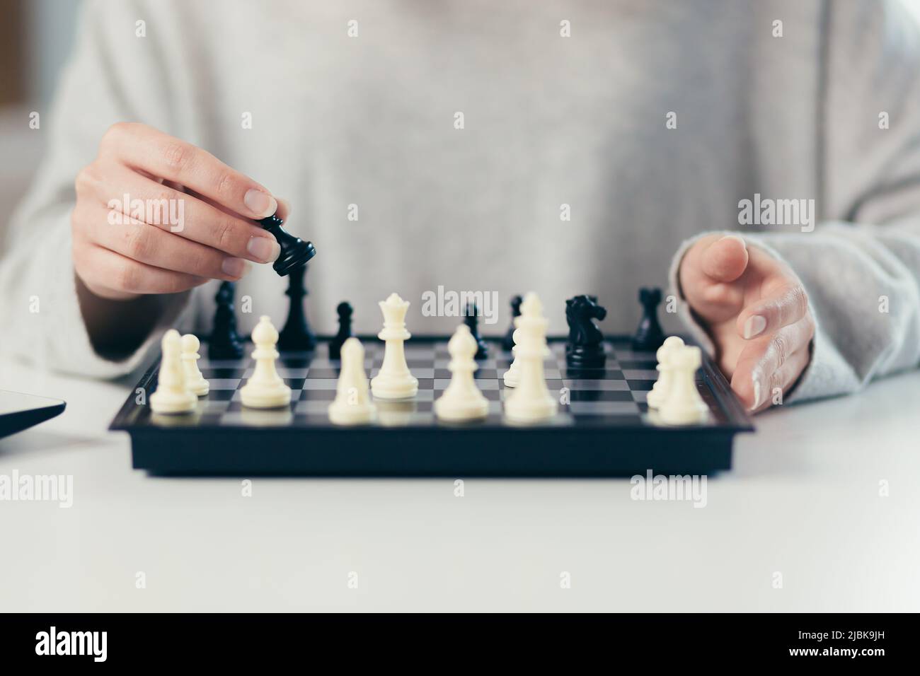 Beautiful woman playing chess hi-res stock photography and images - Alamy