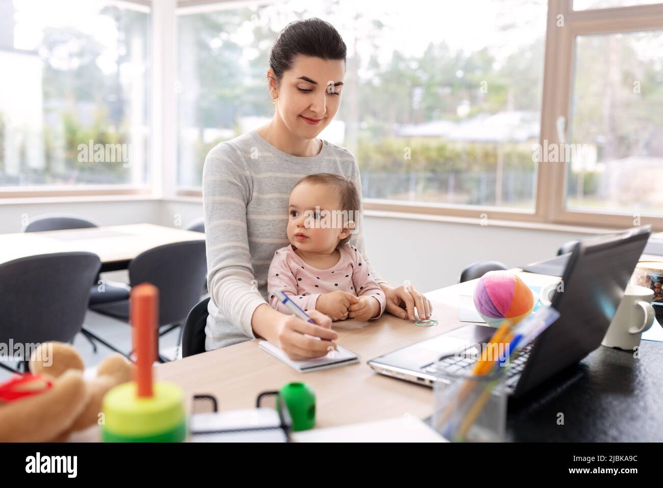 Woman work baby office hi-res stock photography and images - Alamy