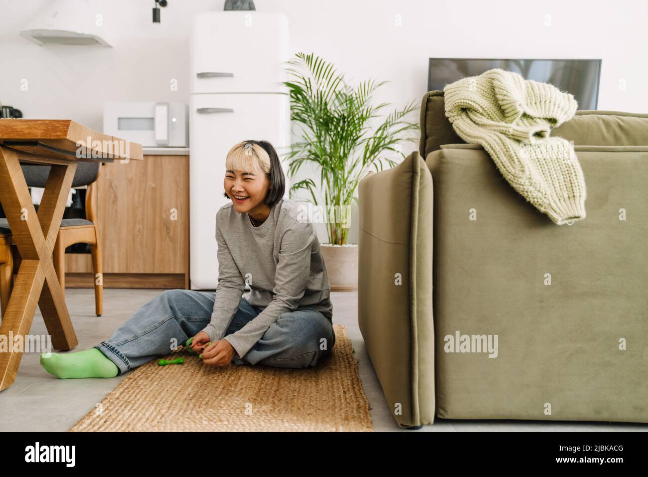 Teen girl sitting on carpet hi-res stock photography and images - Alamy