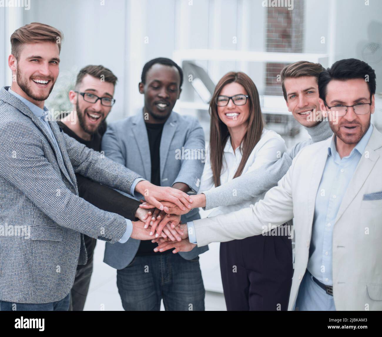 business team shows their unity Stock Photo - Alamy