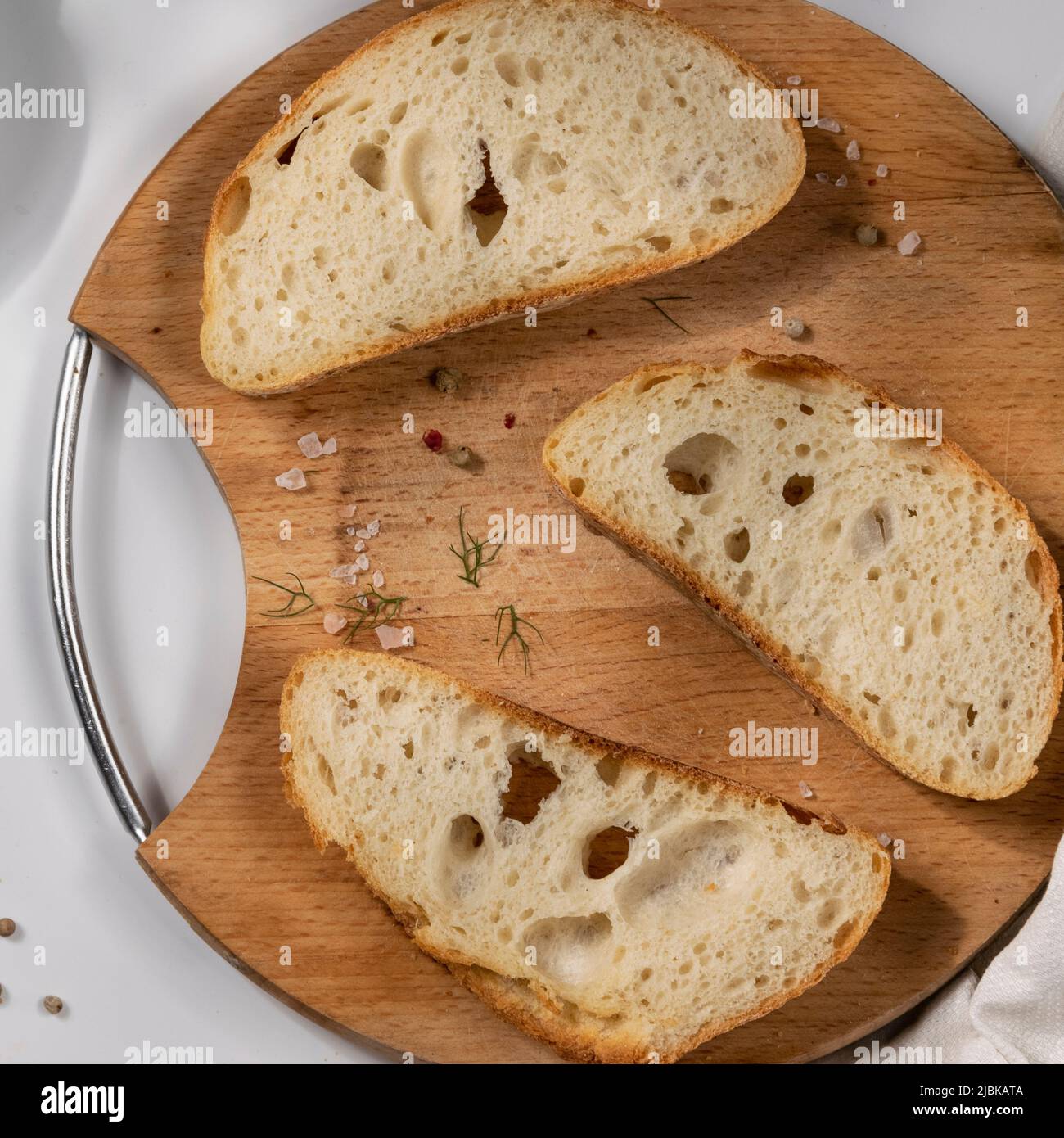 Slices of wholemeal bread in empty plates, dieting, poverty concept ...
