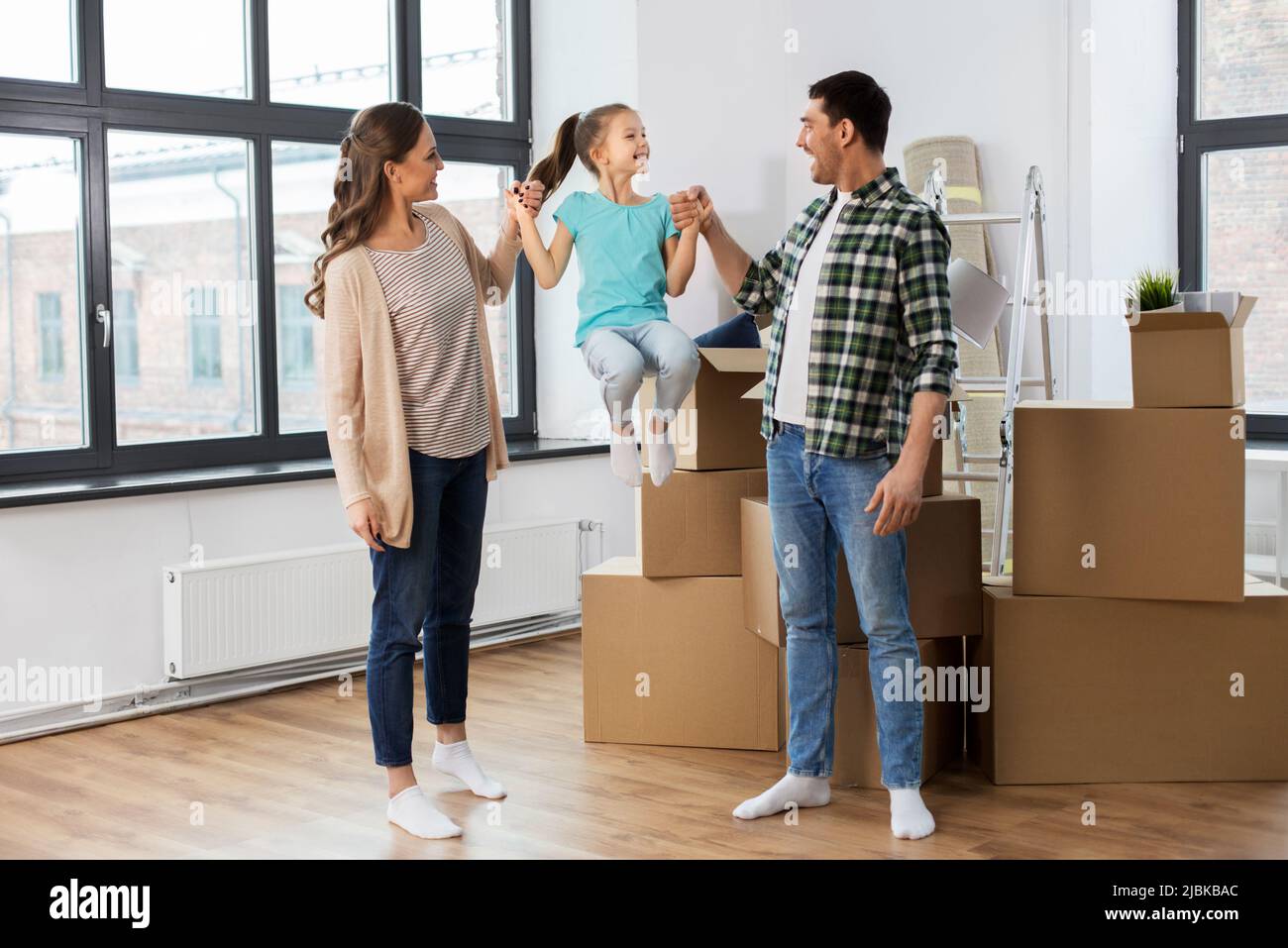 happy family with child moving to new home Stock Photo - Alamy