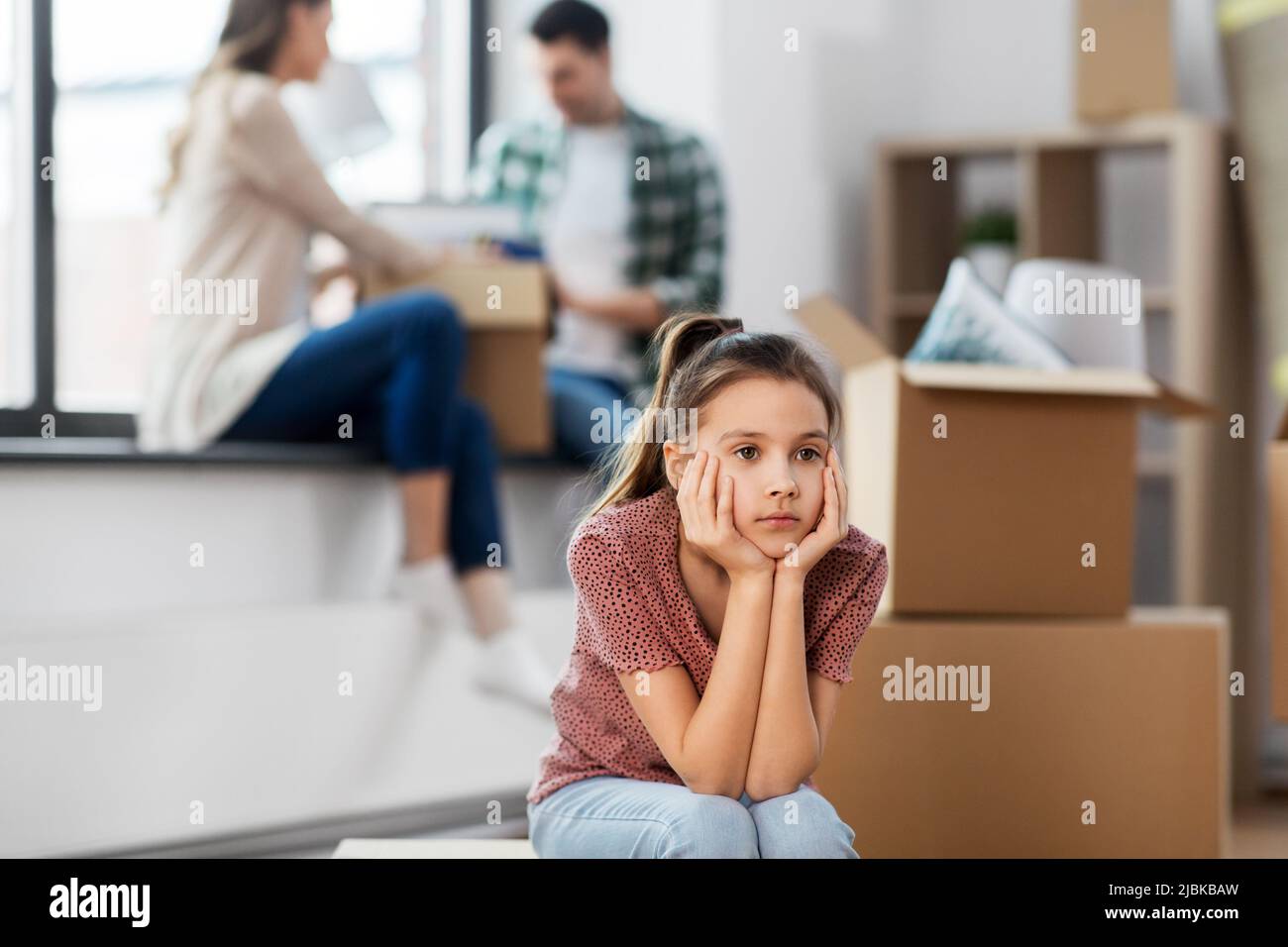 sad girl moving to new home with her family Stock Photo - Alamy