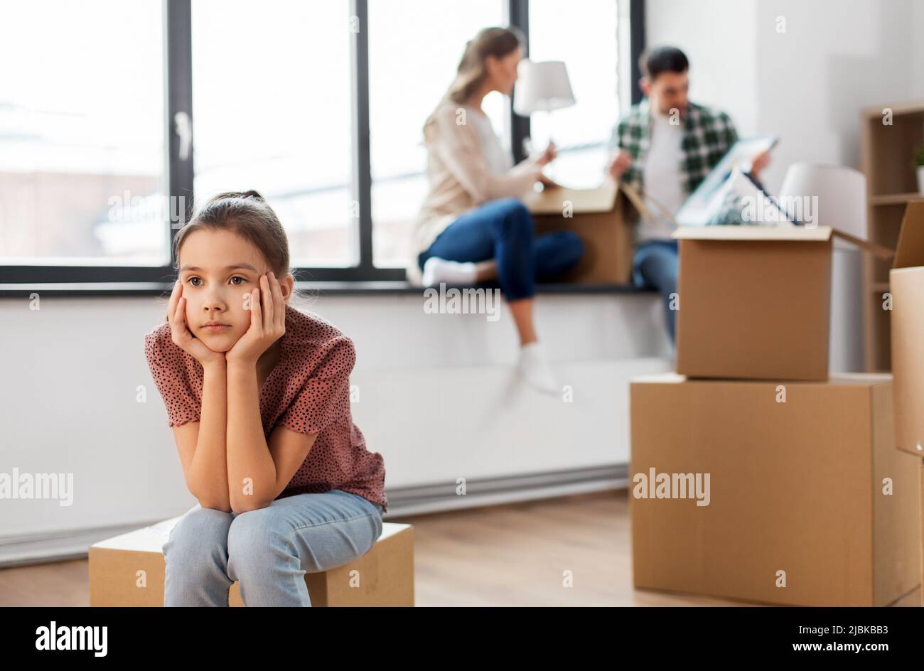 sad girl moving to new home with her family Stock Photo - Alamy