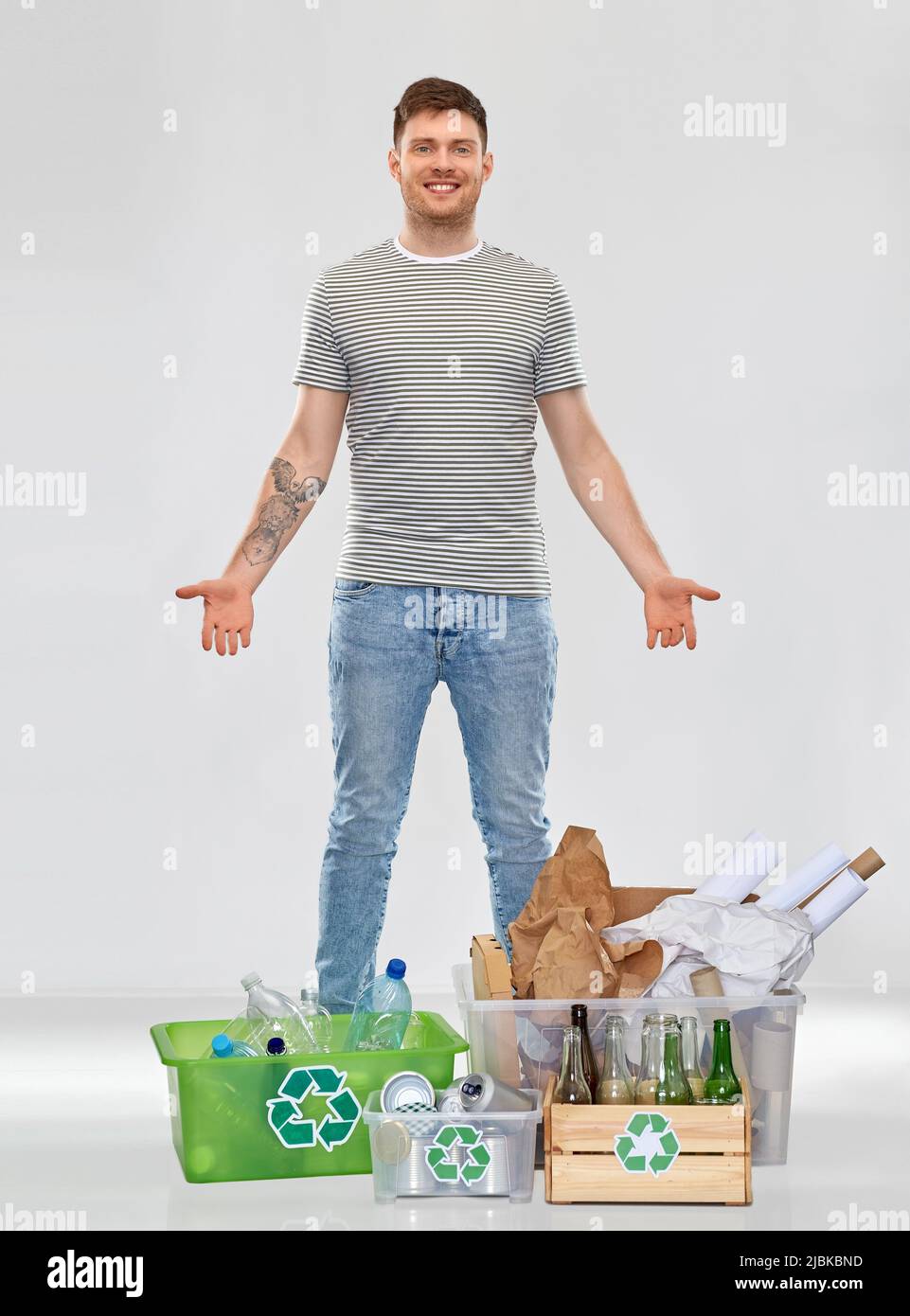 smiling man sorting paper, metal and plastic waste Stock Photo - Alamy