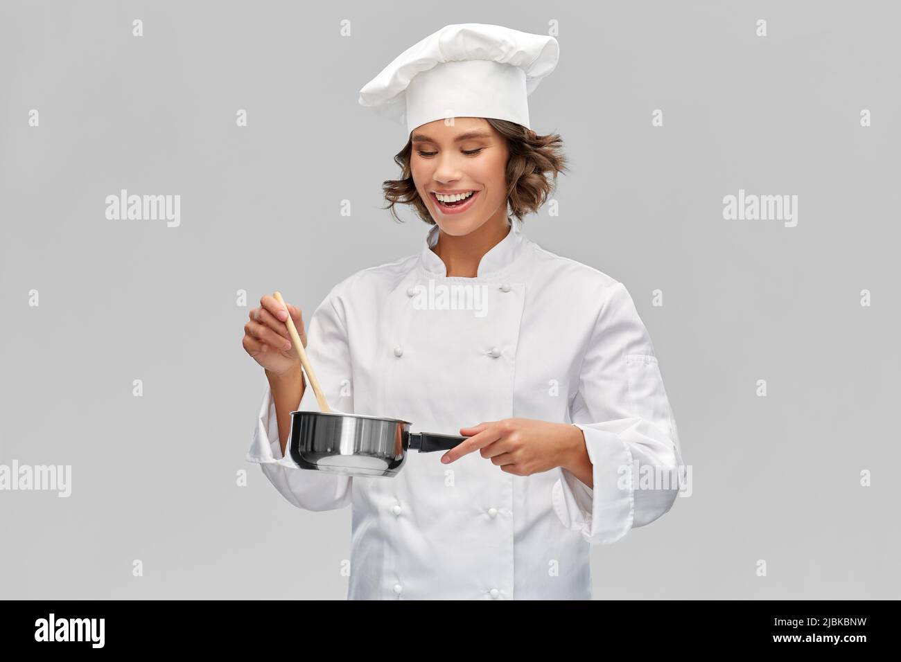 happy smiling female chef with saucepan Stock Photo - Alamy