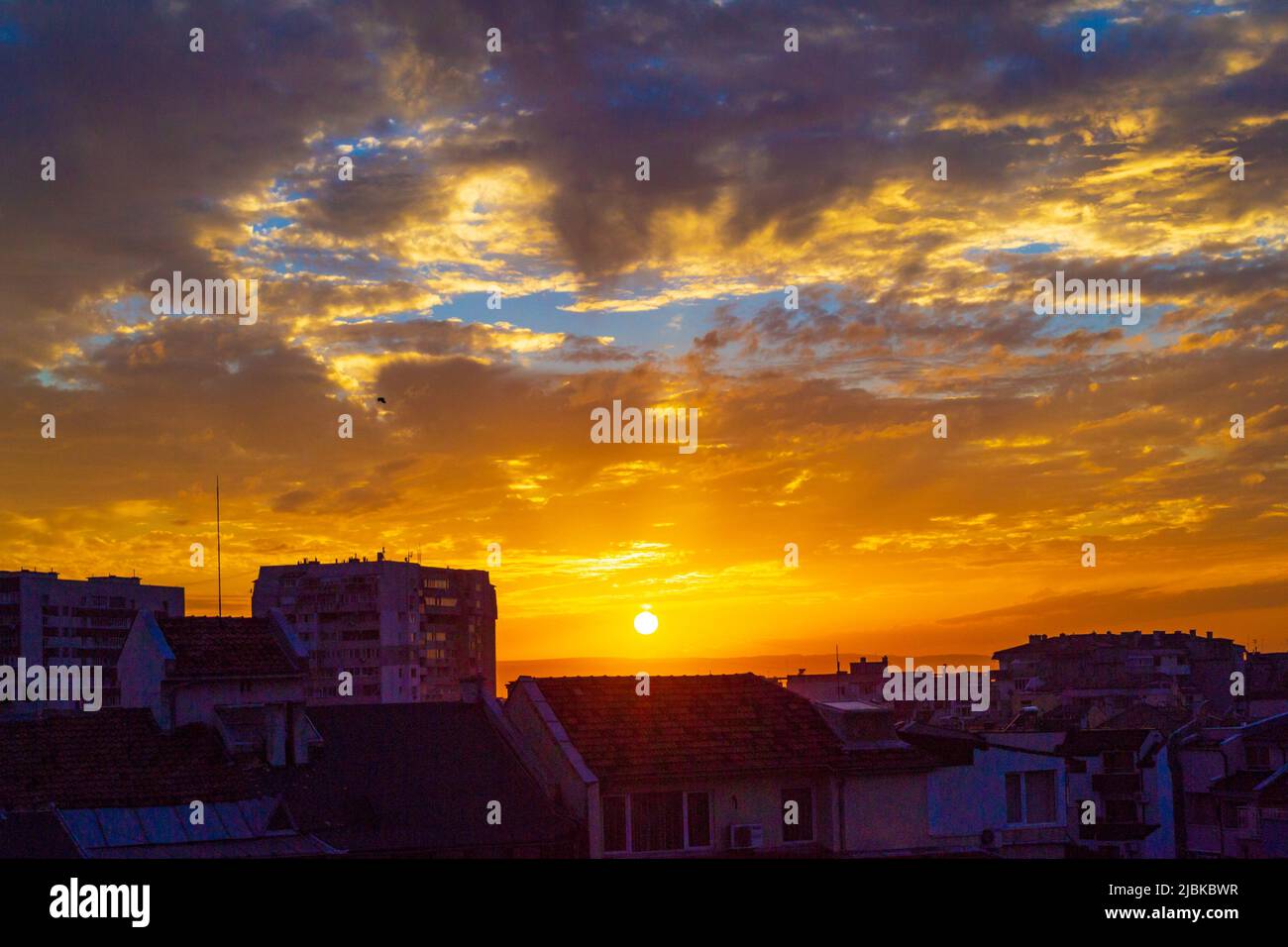 Colorful dramatic skies over residential district of Varna city ...