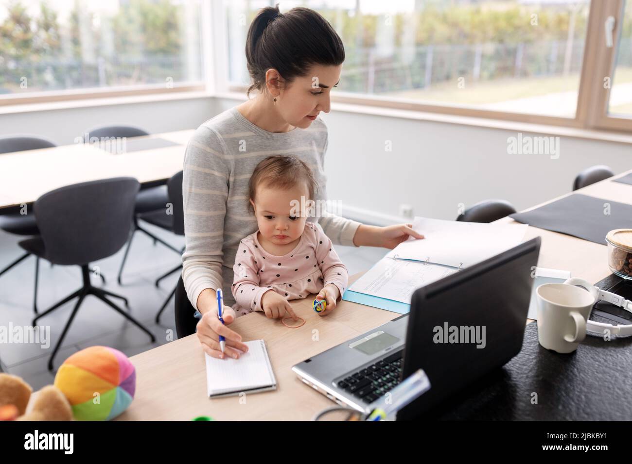 Woman work baby office hi-res stock photography and images - Alamy