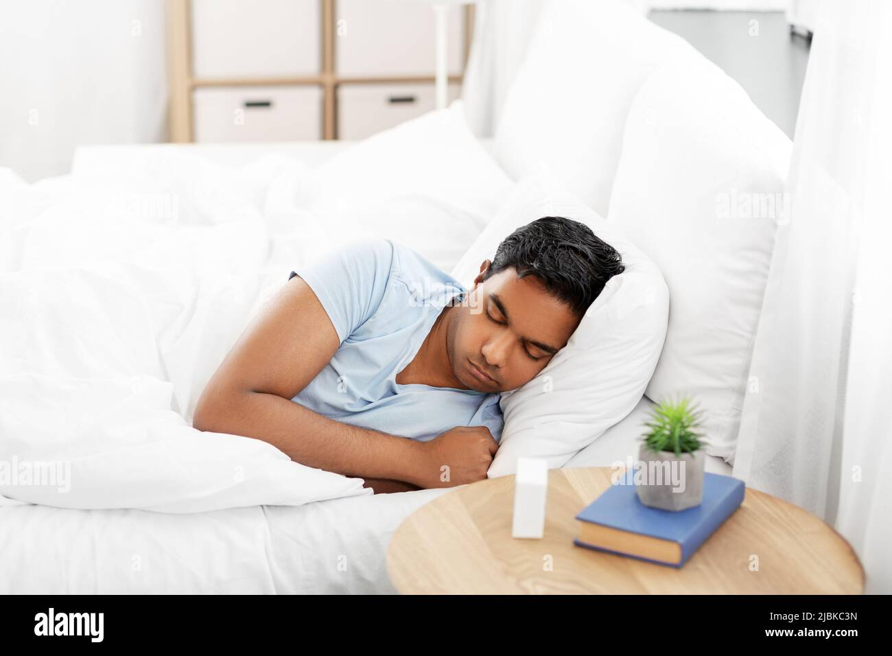indian man sleeping in bed at home Stock Photo - Alamy