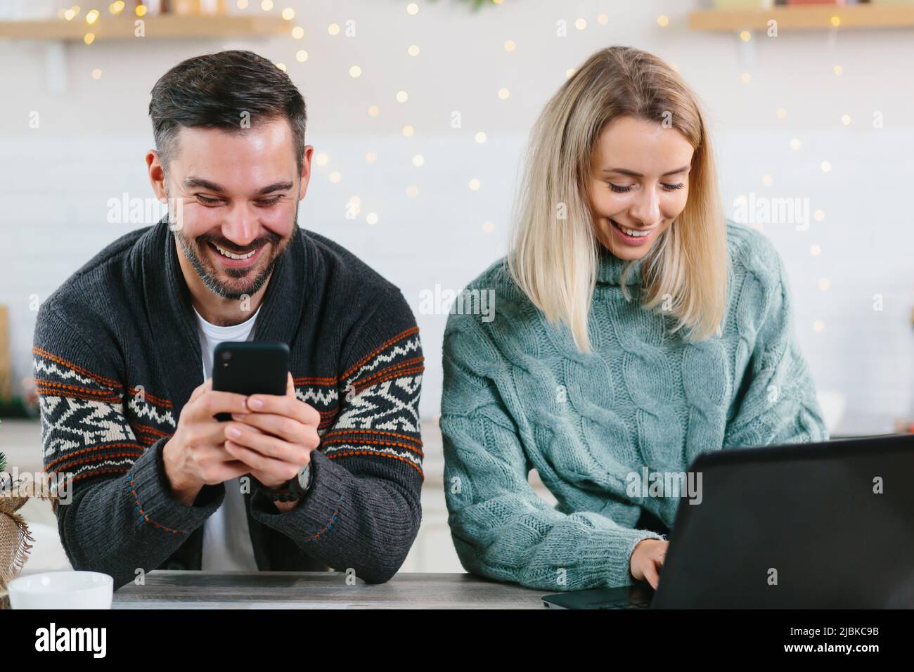 Young couple husband and wife working together online at home, with ...