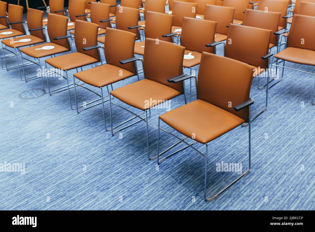 large empty conference room with orange chairs before the auction Stock ...