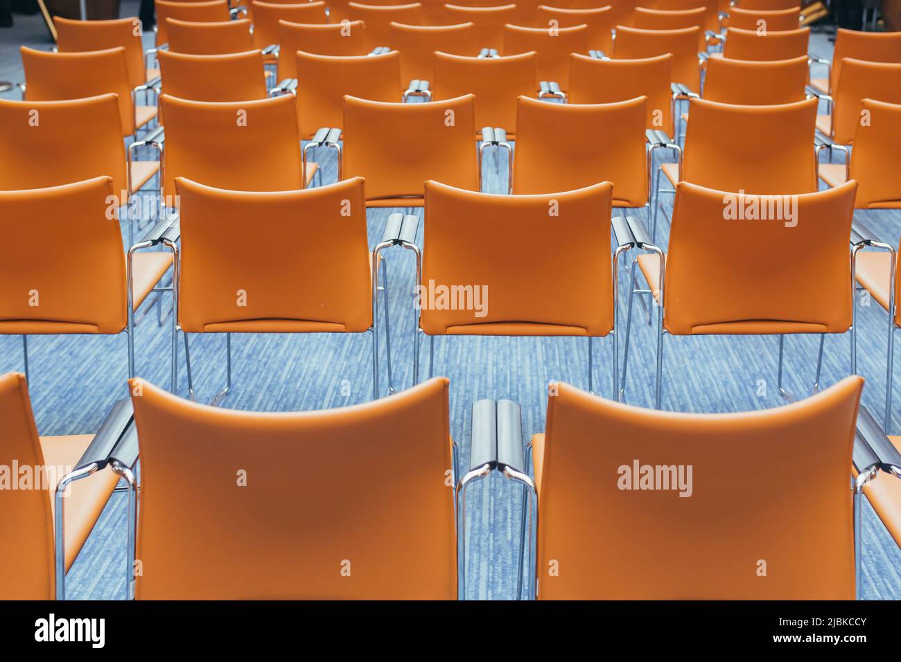 large empty conference room with orange chairs before the auction Stock ...