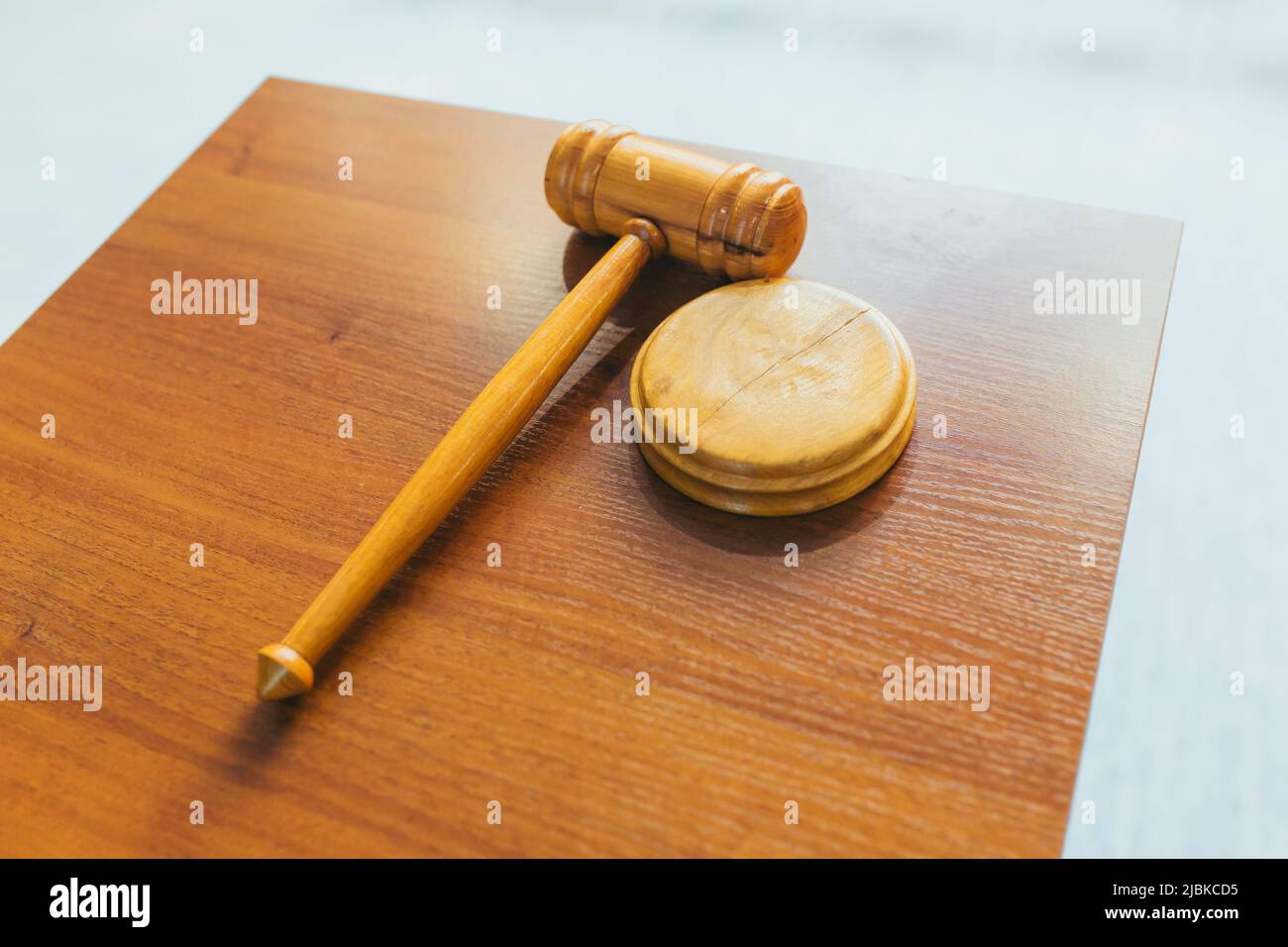 Big wooden hammer for auction Stock Photo - Alamy