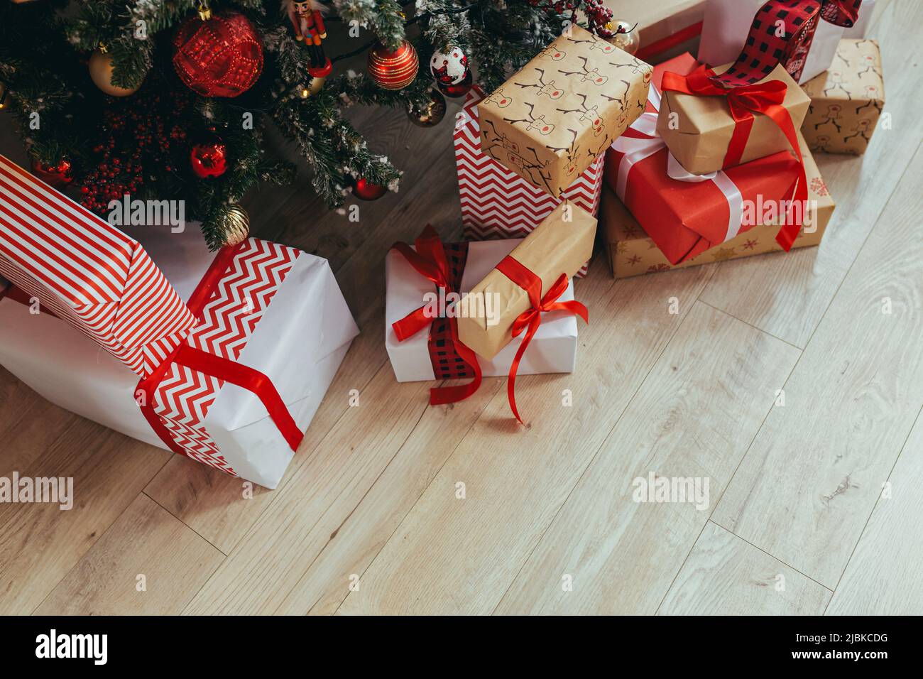 Multicolored gifts under the Christmas tree photo close-up New Year's ...