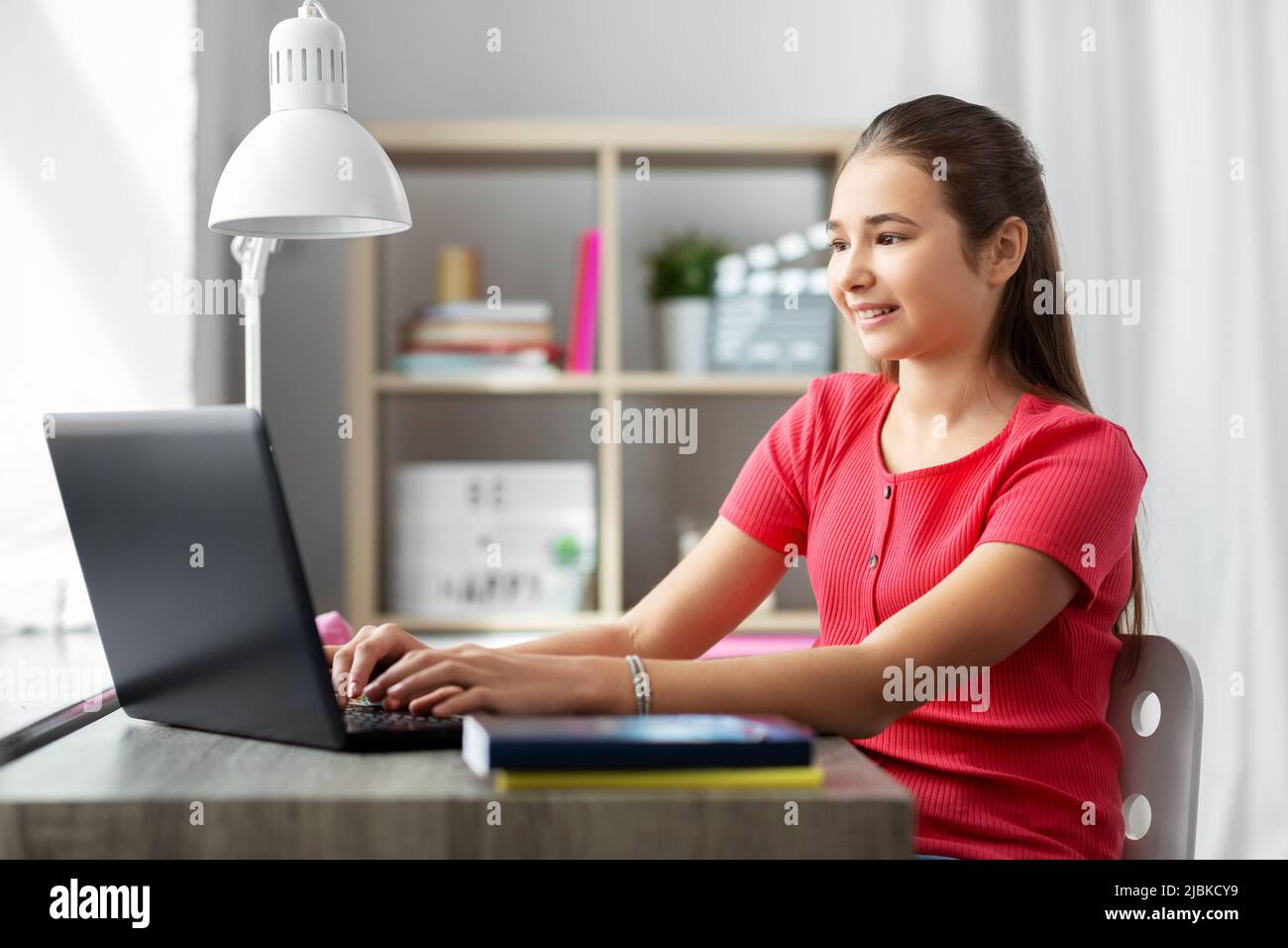 student girl with laptop computer learning at home Stock Photo - Alamy