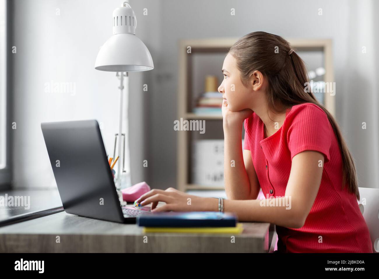student girl with laptop computer learning at home Stock Photo - Alamy