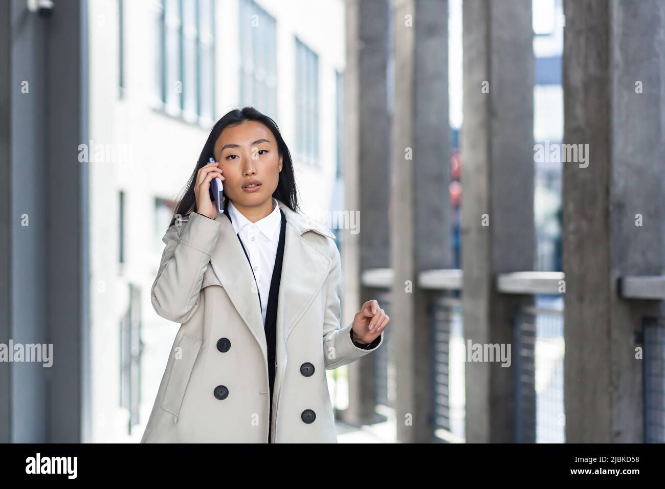 Beautiful and happy asian woman talking on the phone, Chinese student ...