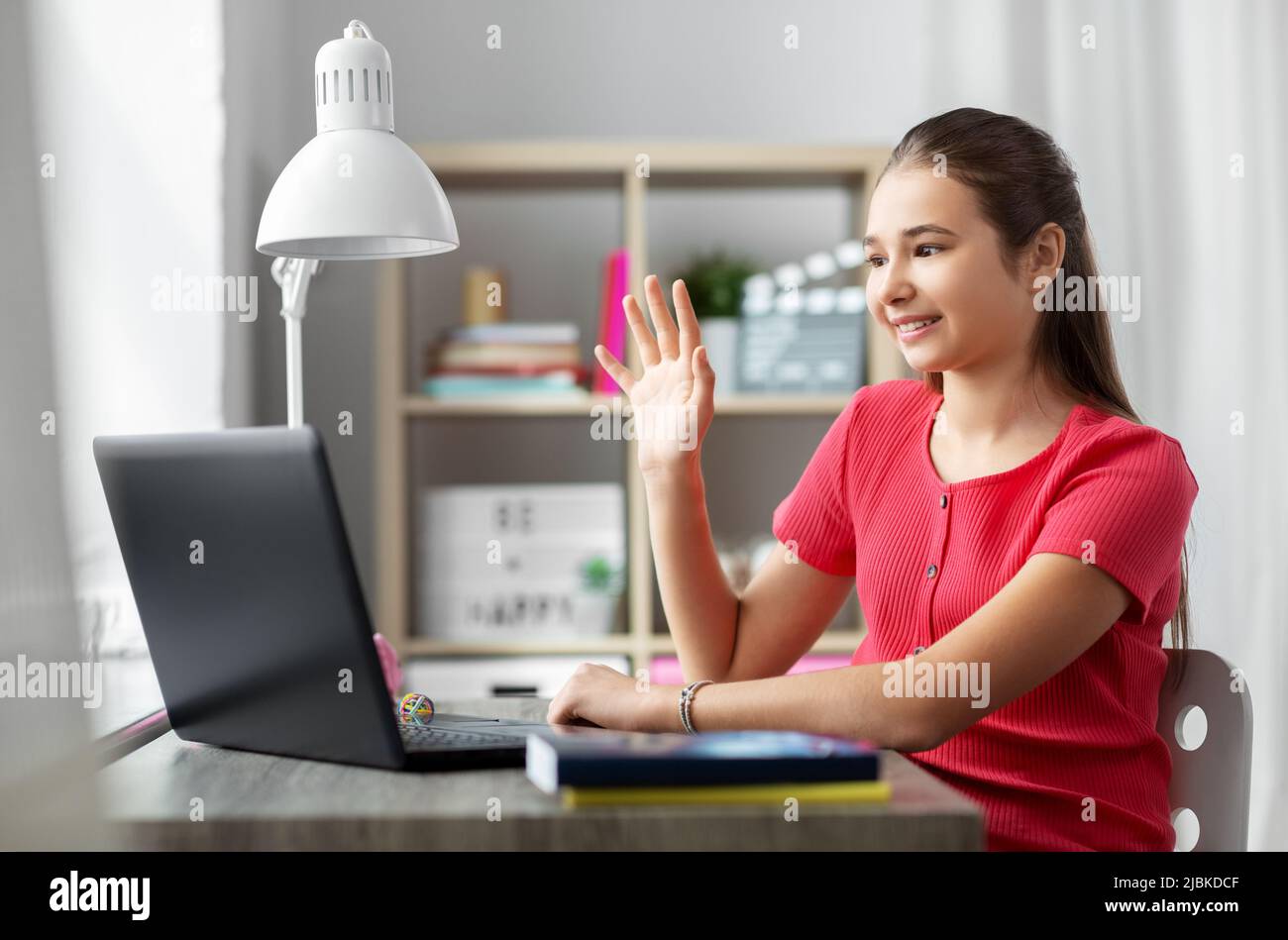 student girl with laptop having video call at home Stock Photo - Alamy
