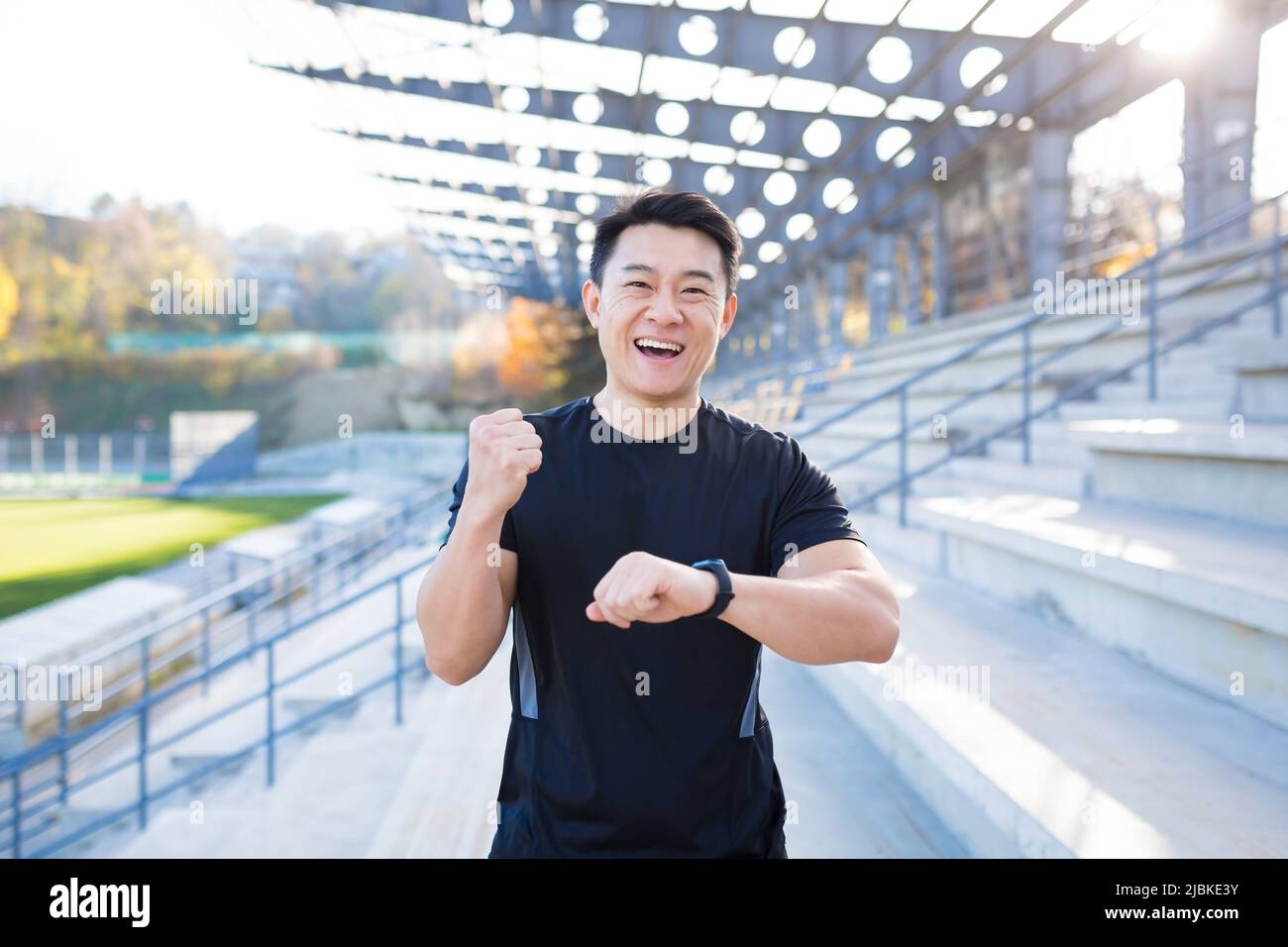 Confident athlete smiles camera running hi-res stock photography and ...