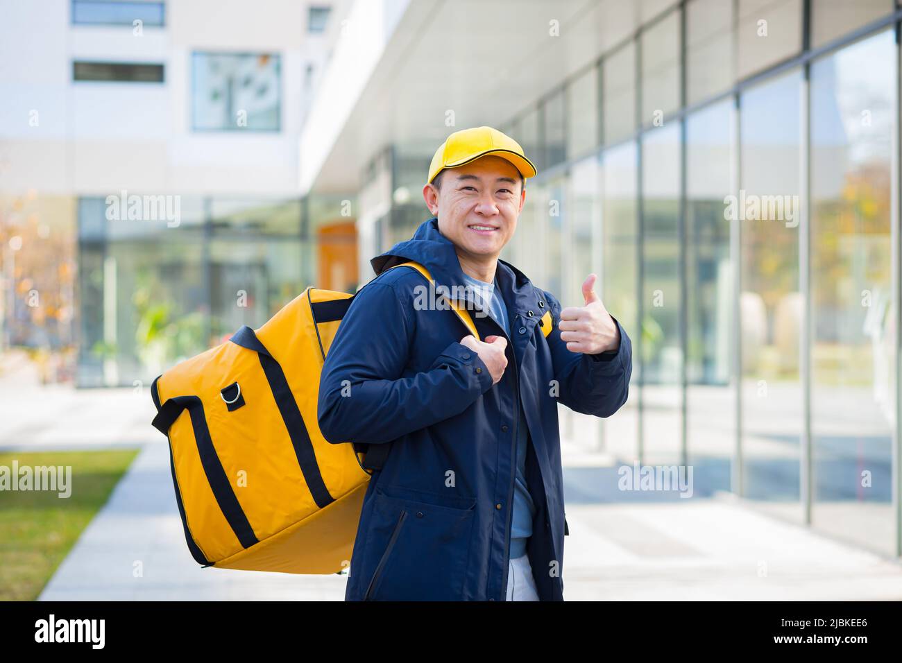 Asian delivery man in looks hi-res stock photography and images - Alamy