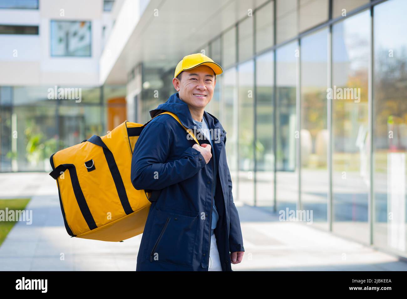 Young japanese delivery man box hi-res stock photography and images - Alamy