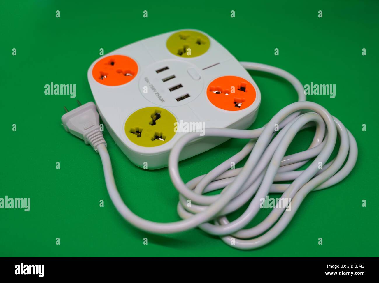 4-pin power socket with USB port on green background Stock Photo - Alamy