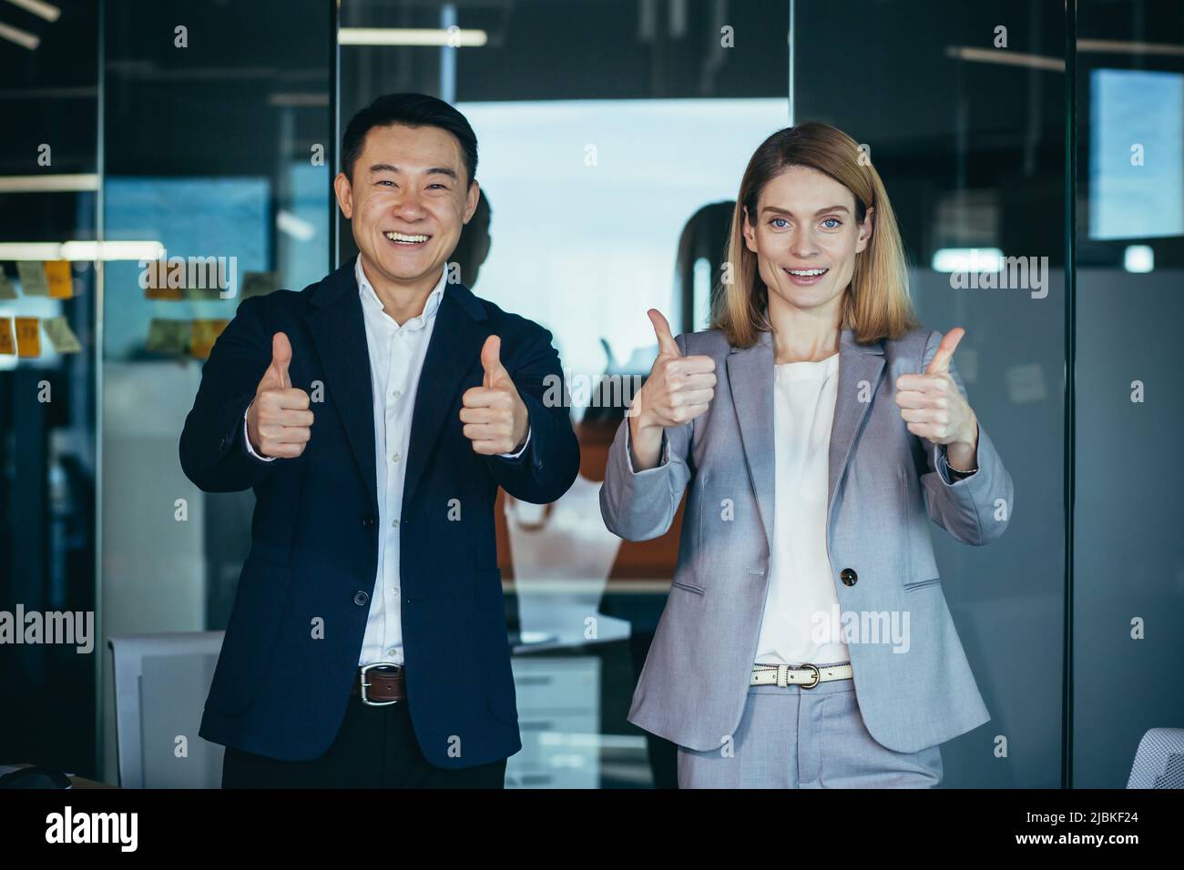 Team of successful managers, group of Asian man and woman, in business ...