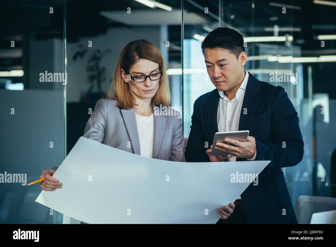 Thoughtful woman planning paper tablet hi-res stock photography and ...