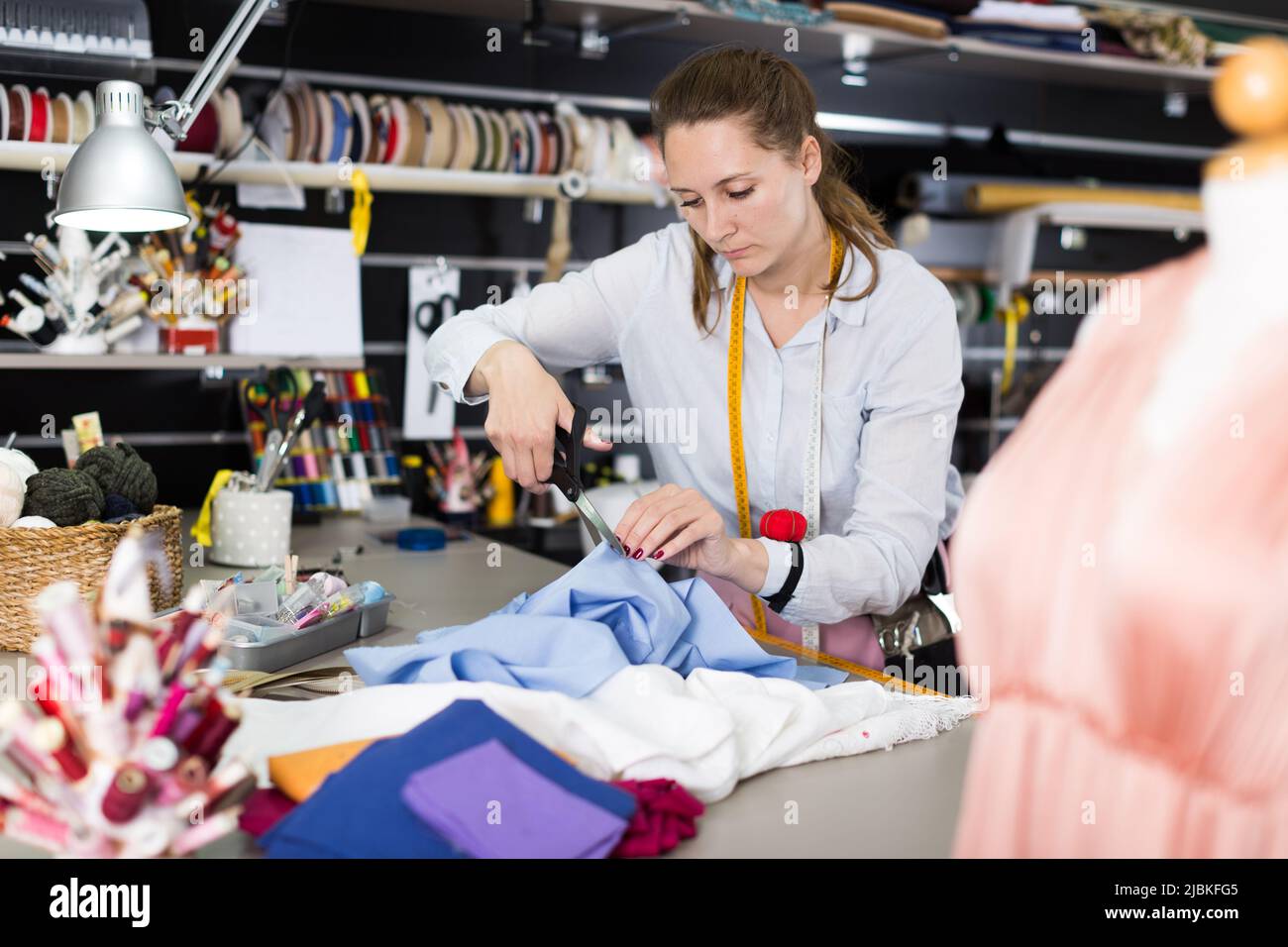 Woman is doing modern patterns for new fashion collection Stock Photo ...