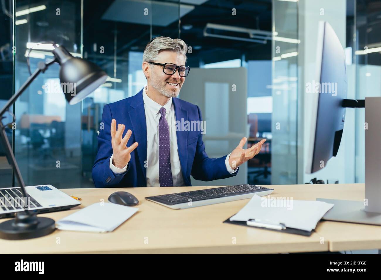 Angry and upset boss businessman shouting at computer monitor, man with ...