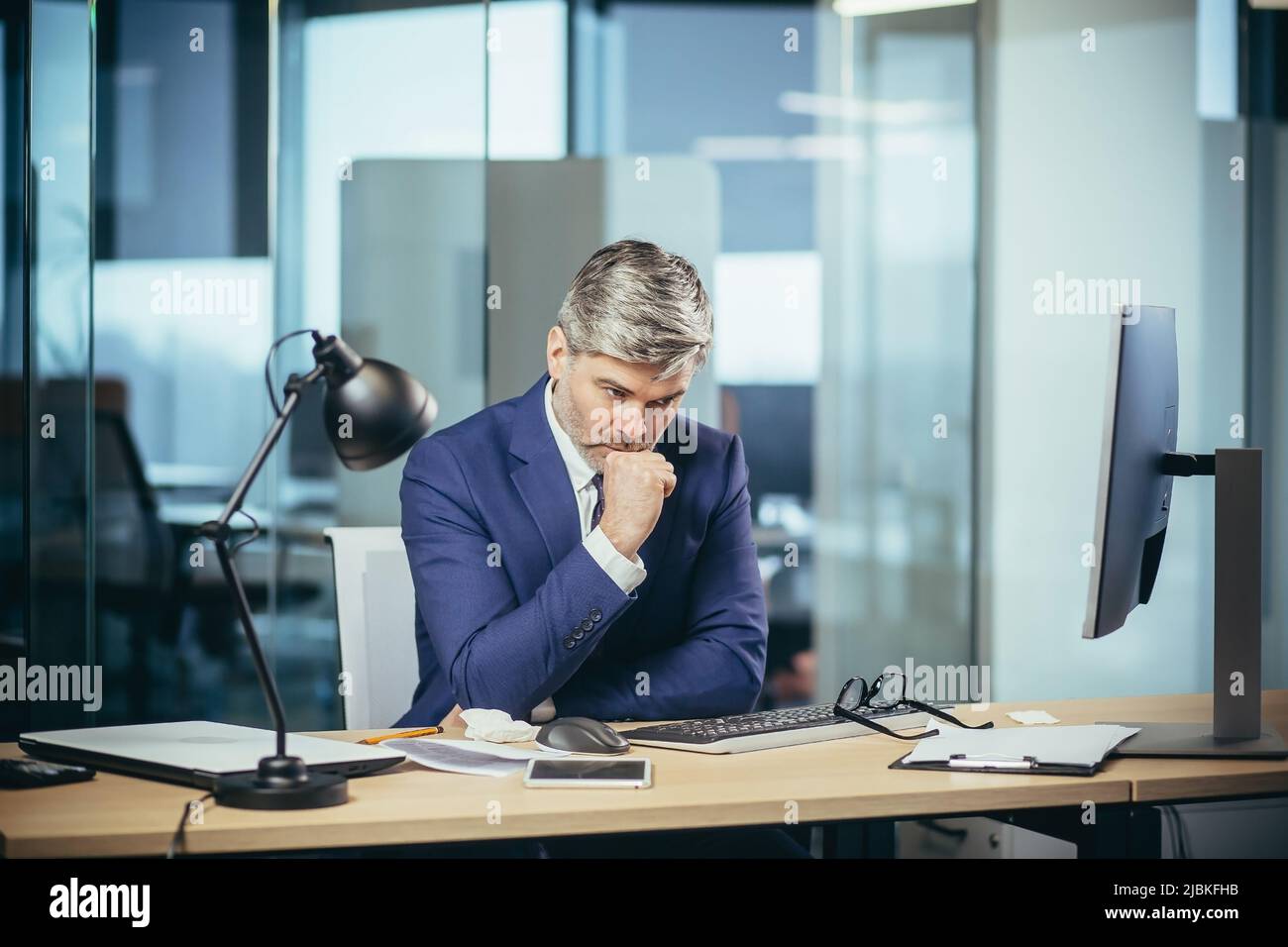 Businessman working at computer, sick man coughing at work Stock Photo ...