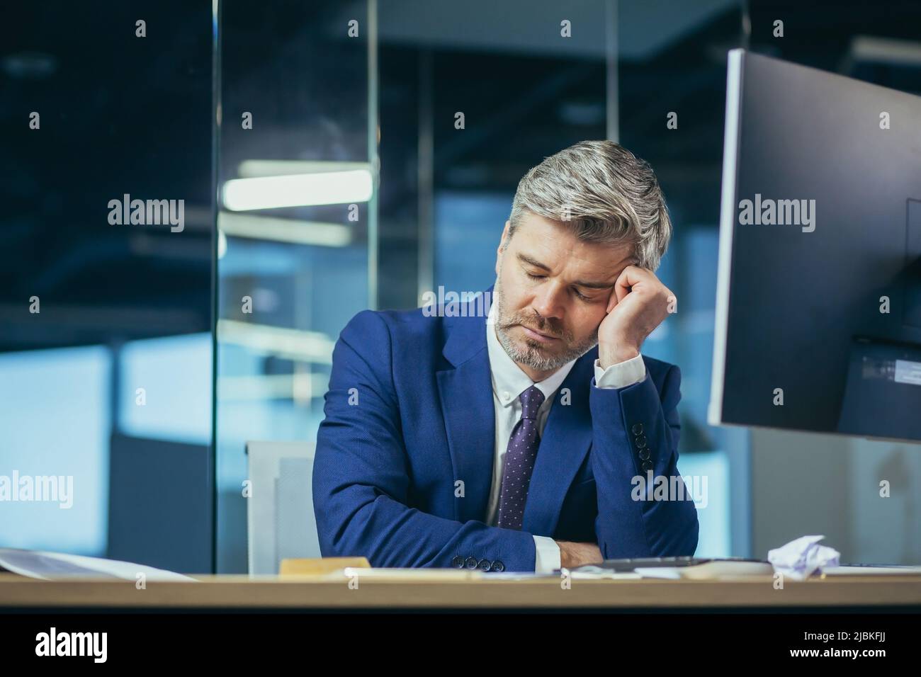 Tired senior boss businessman sleeping on desktop in office Stock Photo ...