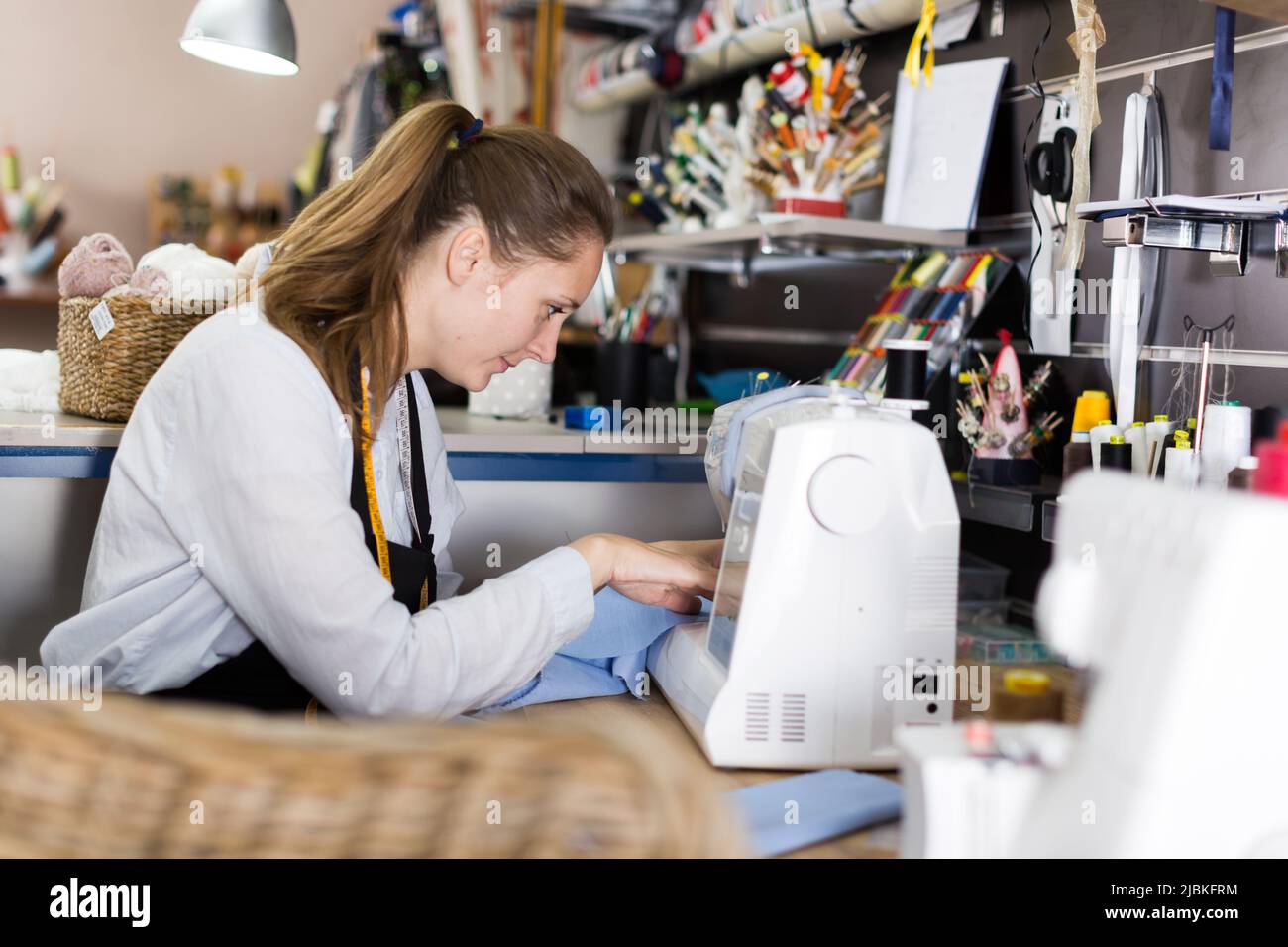 Mature woman working sewing machine hi-res stock photography and images ...
