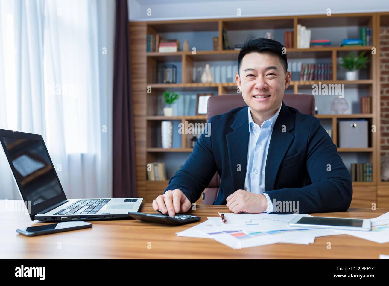 Handsome asian male employee works hi-res stock photography and images ...