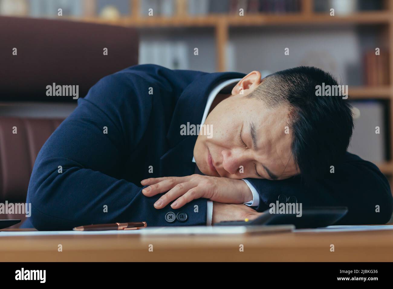 Asian businessman sleeping tired lying on the table, man at work Stock ...