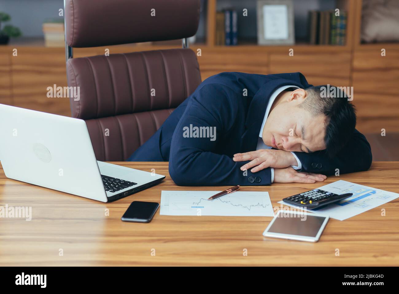 Asian businessman sleeping tired lying on the table, man at work Stock ...