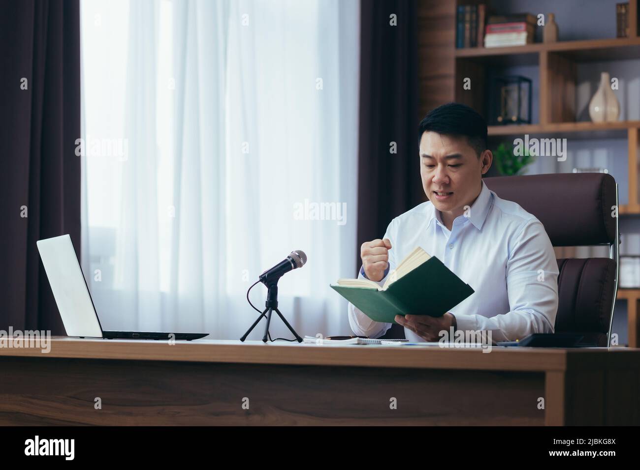 Asian preacher reads bible hi-res stock photography and images - Alamy