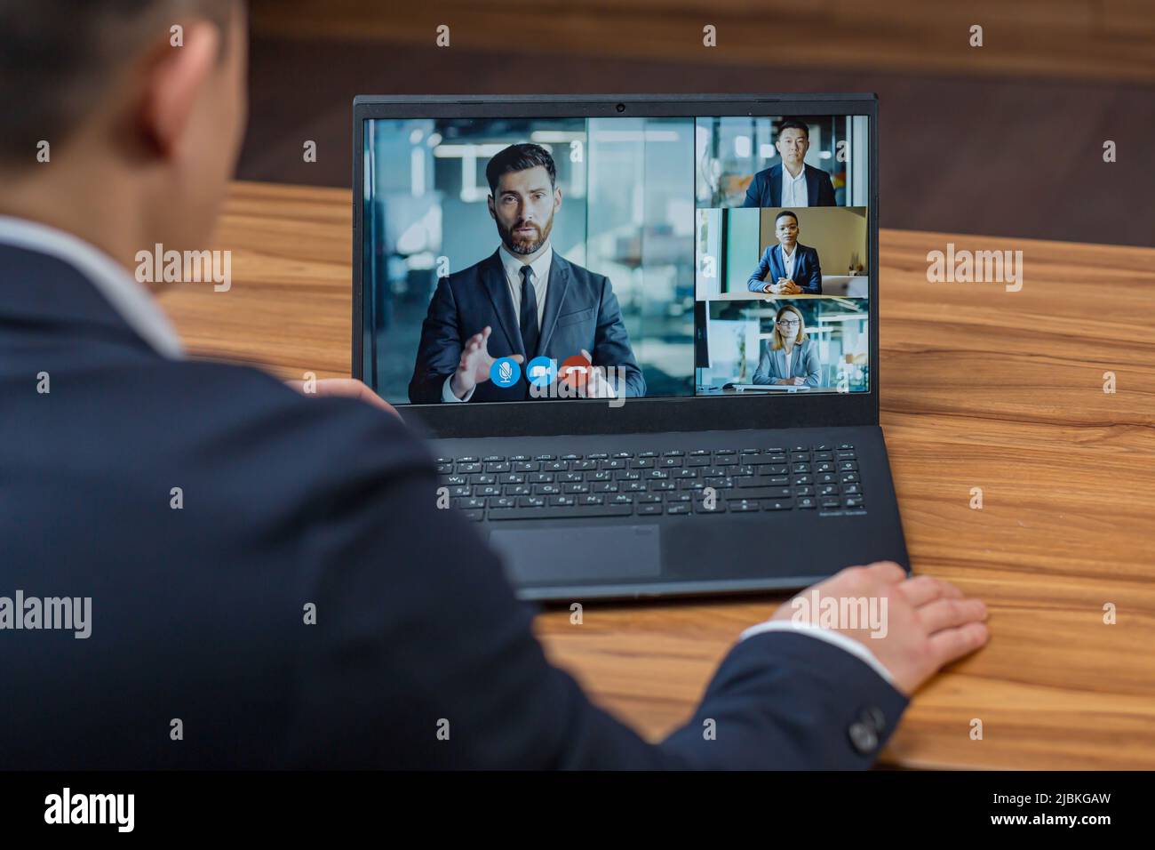 Male asian boss talking on video call with colleagues, online rally ...