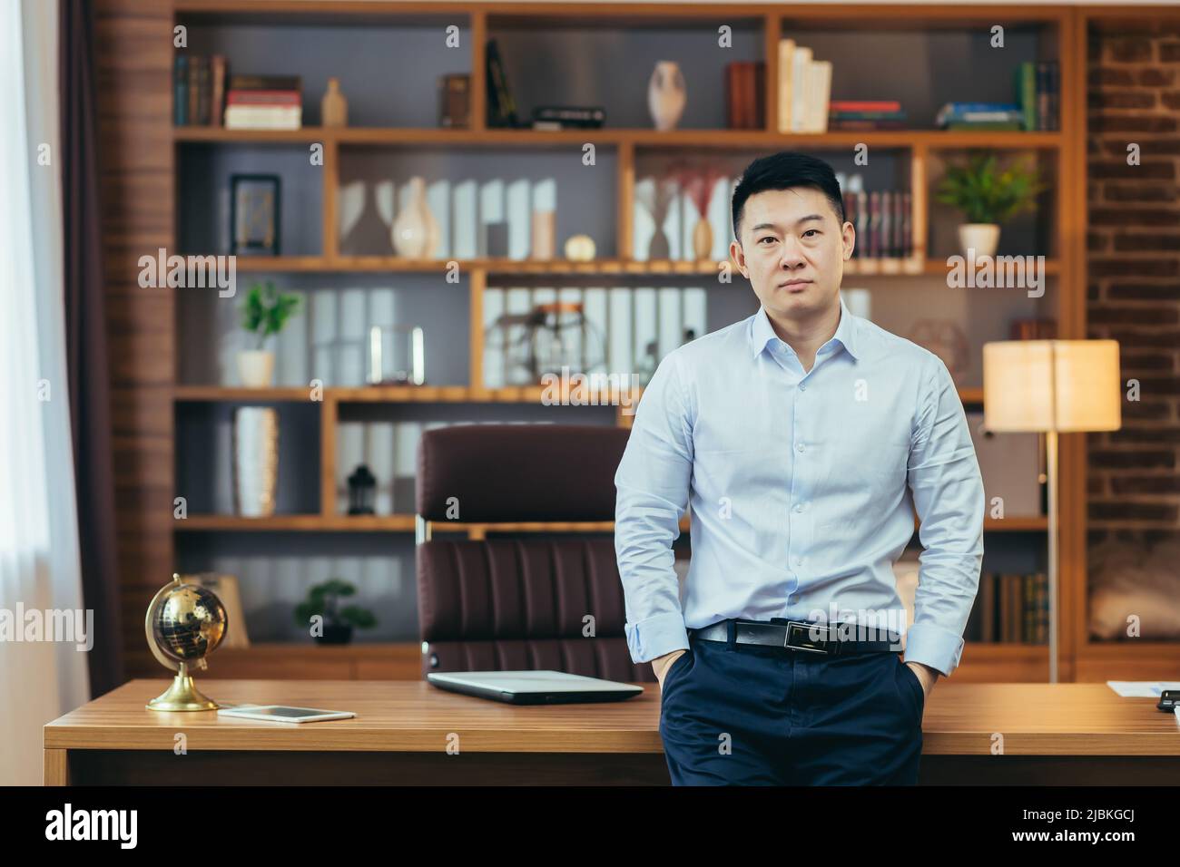 Portrait of a successful Asian businessman, serious and focused man ...