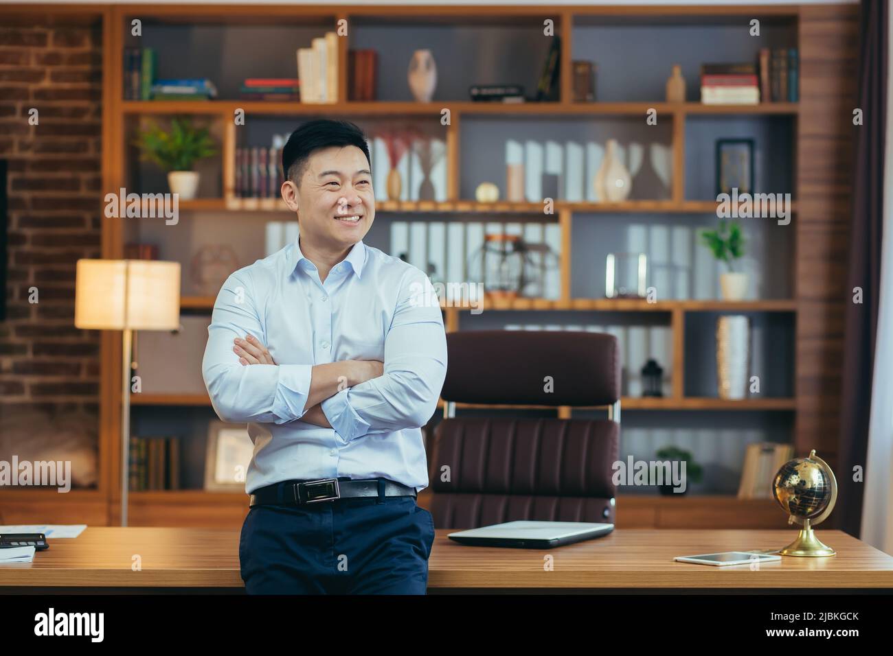 Portrait of a successful businessman working in a classic office, Asian ...