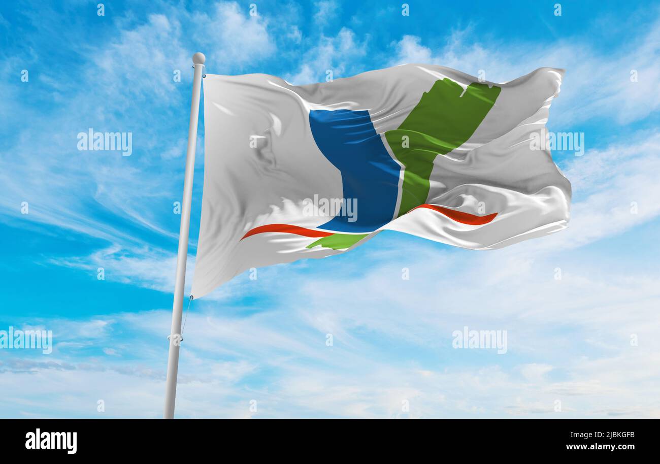 flag of department of Yonne, France at cloudy sky background on sunset ...