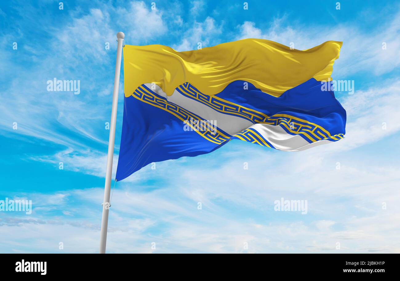flag of department of Aube, France at cloudy sky background on sunset ...